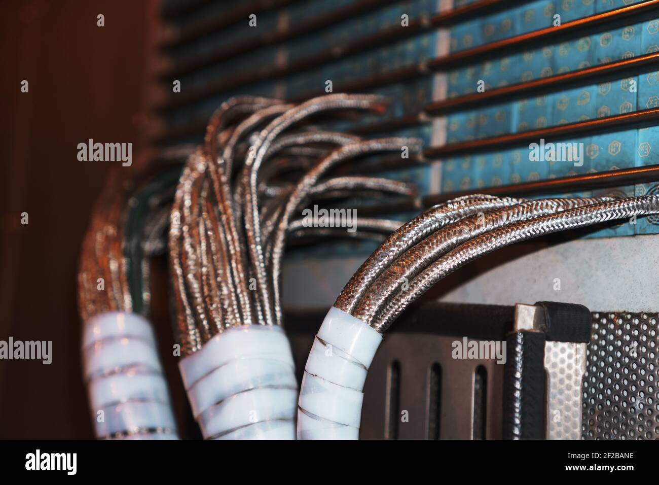 Technological wires in a metal sheath are laid in a cable channel to ...