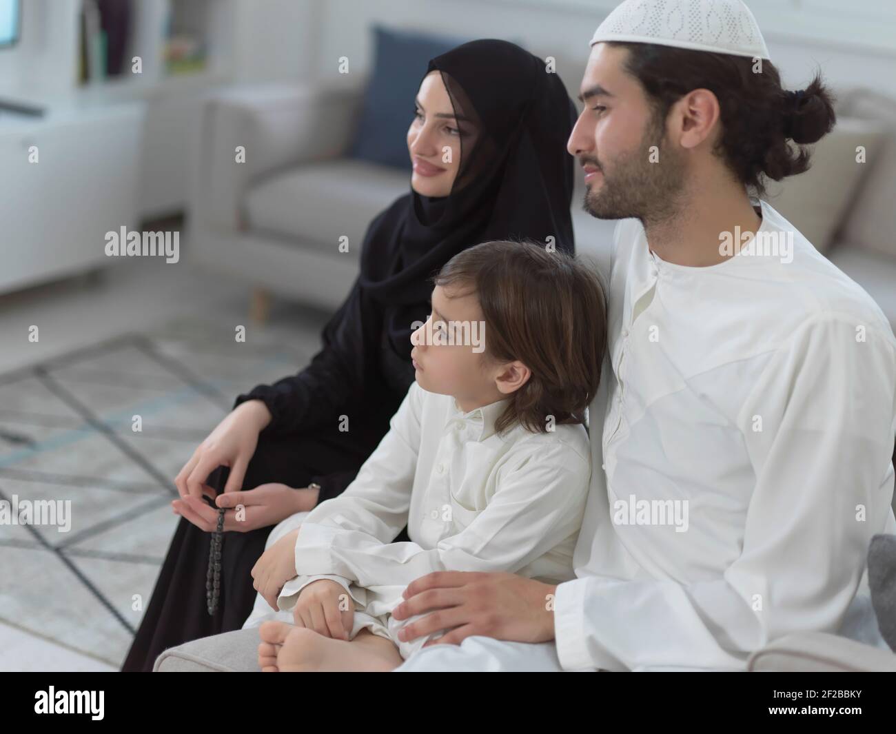 Top view of young arabian muslim family wearing traditional clothes at ...