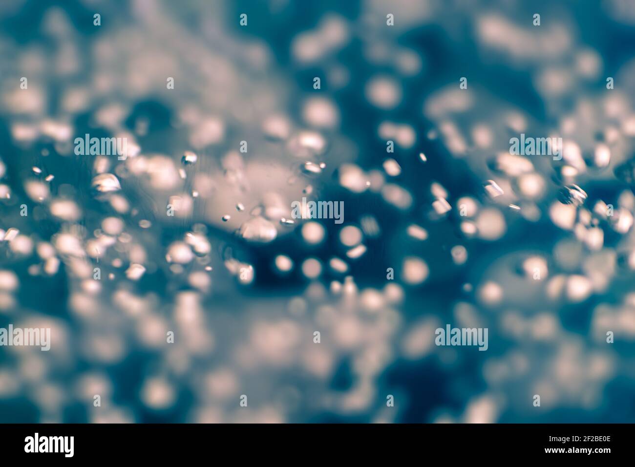Blue abstract background - boiling water in a glass pot, Bubbles and ...