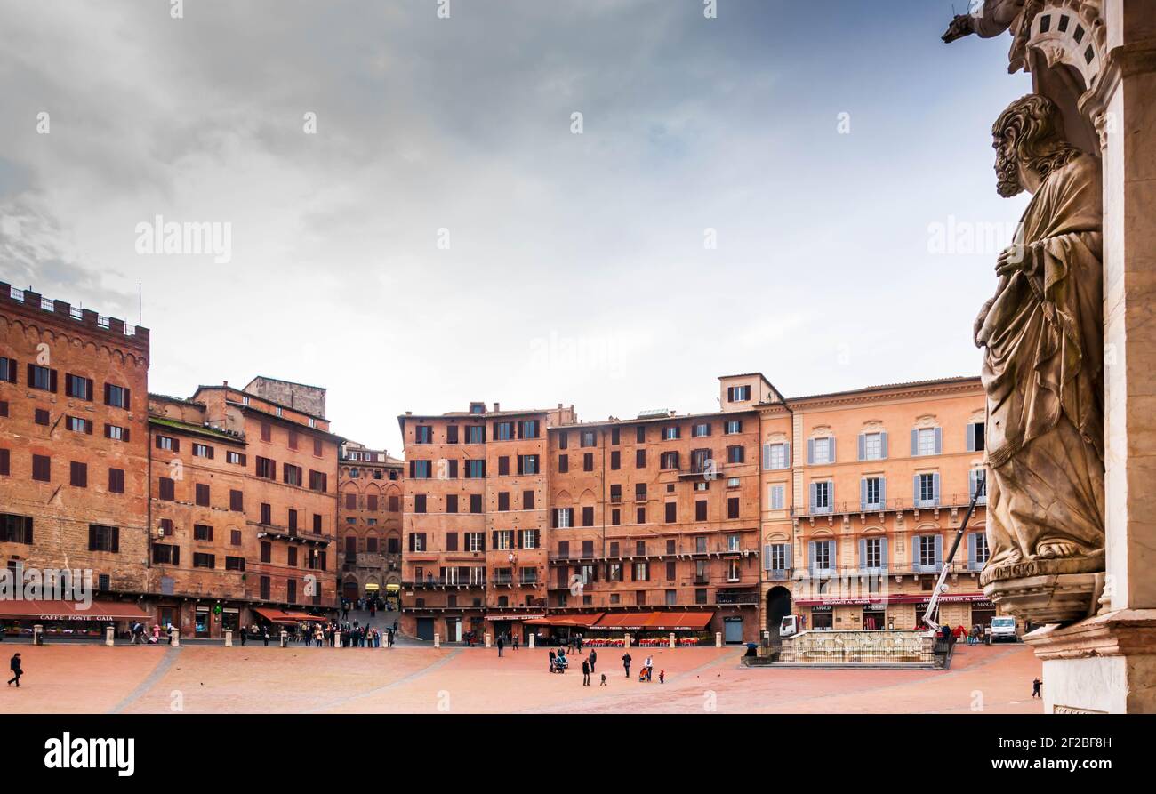 Typical facades in Piazza del Campo from the Palazzo Pubblico in Siena ...