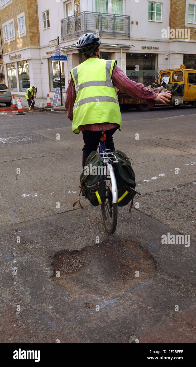 Bikes and Potholes 2/2/07 Tom Pilston Stock Photo - Alamy