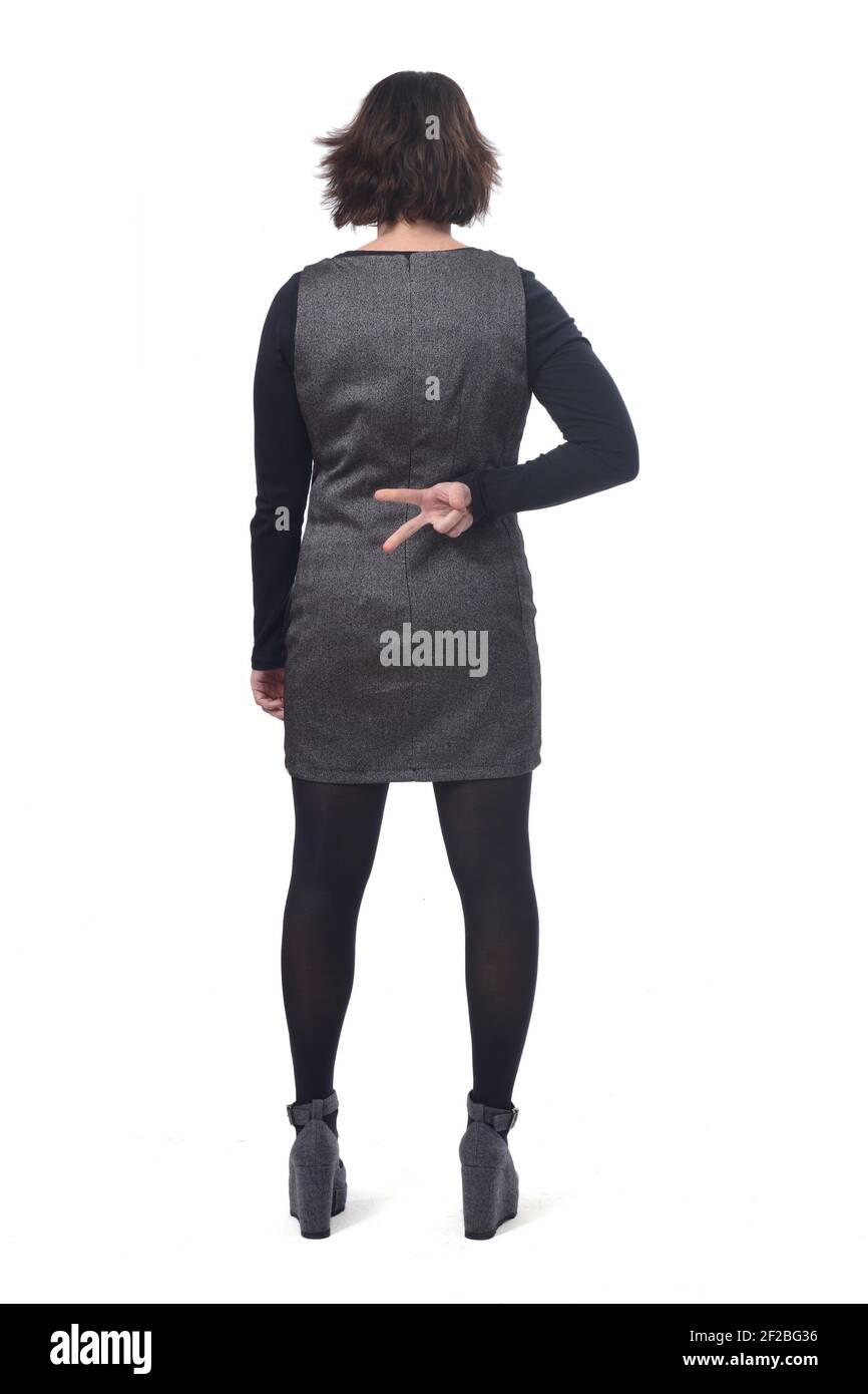 portait of a full portrait woman showing two finger scissors gesture ...