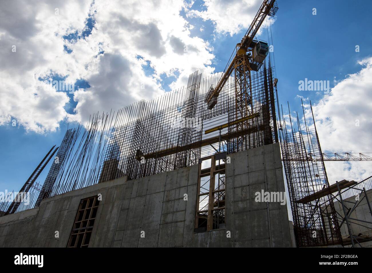 Building crane at the background of building under construction Stock ...