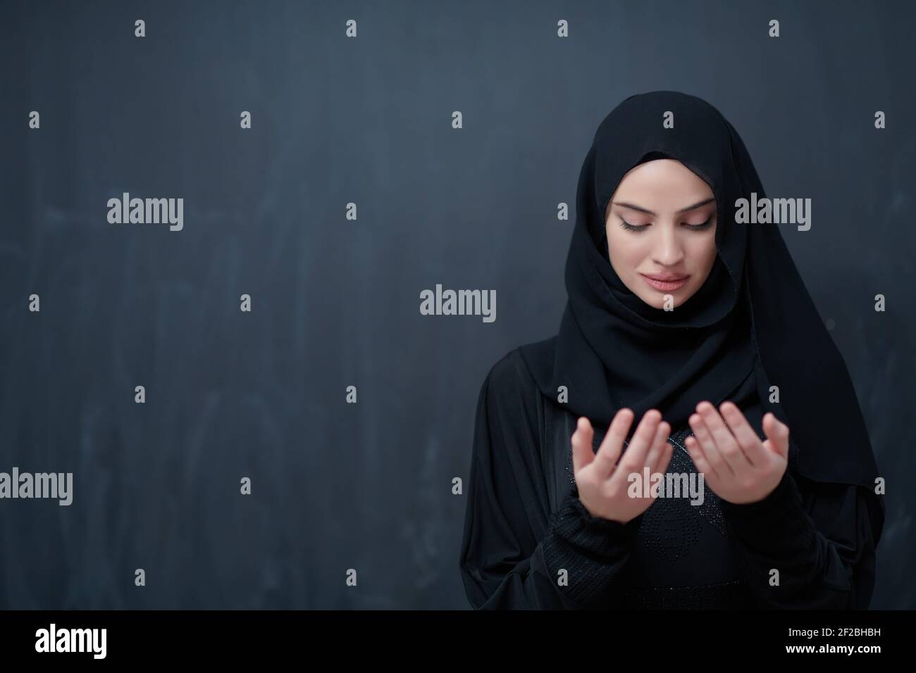 Portrait of young Muslim woman making dua Stock Photo - Alamy