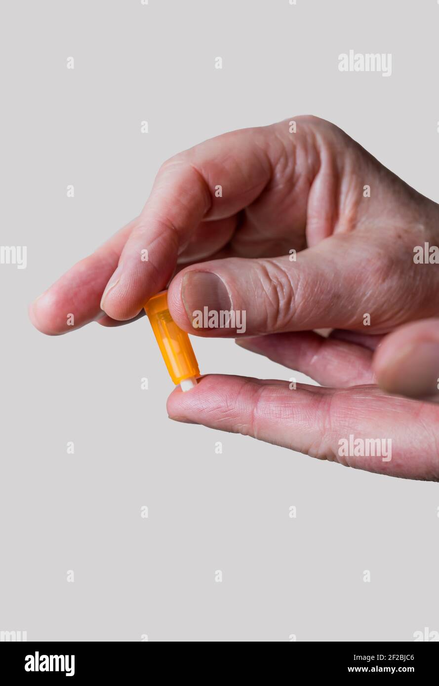 Man's hand holding lancet for medical check blood prick test Stock ...