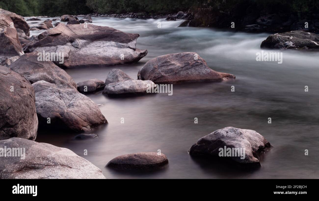 A beautiful view of stones in a river Stock Photo - Alamy