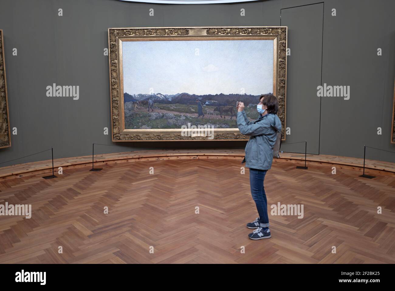 interior of the Segantini Museum, with visitors wearing safety mask ...