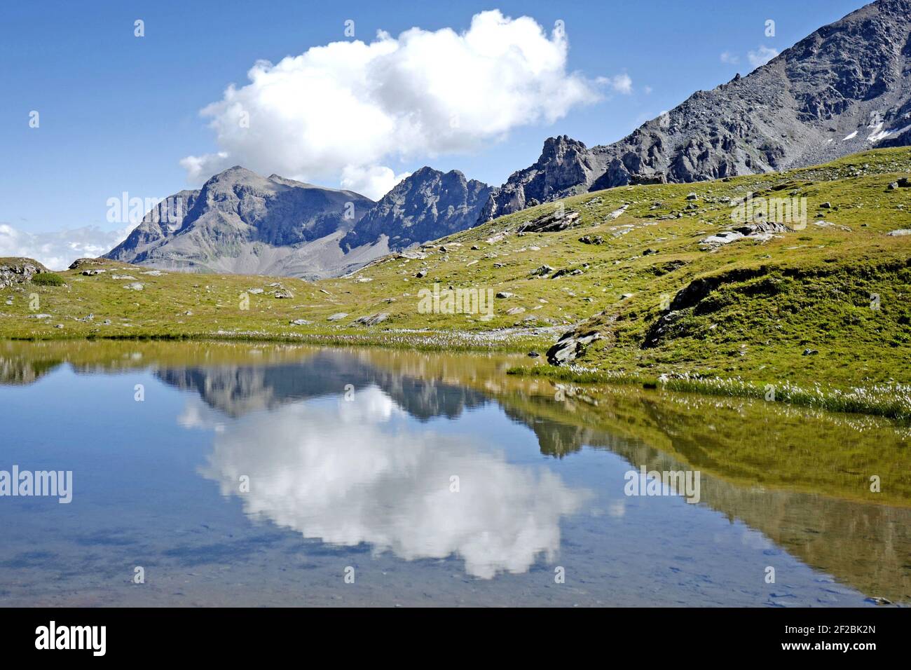 Swiss Alps reflcted on a alpine blue lake. Sils Maria, Maloja ...