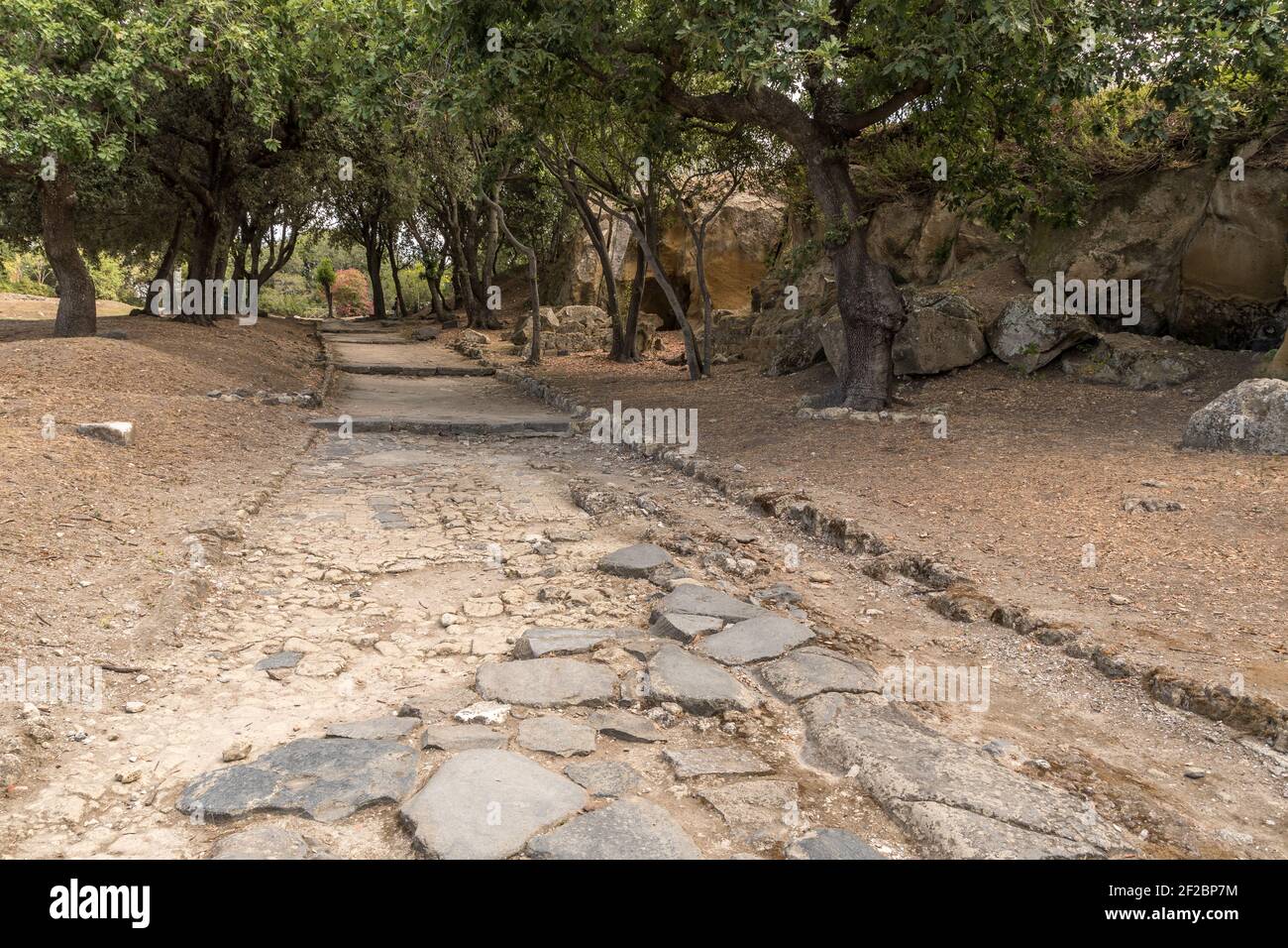 Ancient roman road in the archeological site of Cuma, Campania, Italy ...