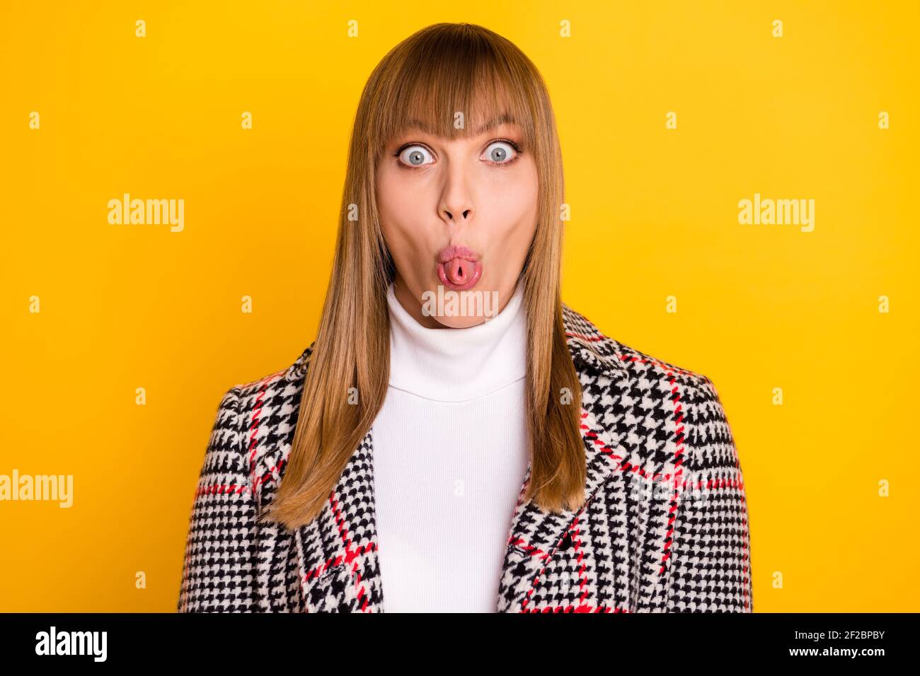 Portrait of young person make stupid grimace tongue out wear checkered ...