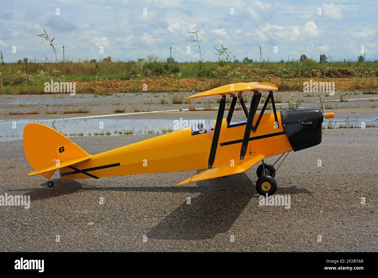 toy model of a biplane airplane stands on a hard surface Stock Photo ...