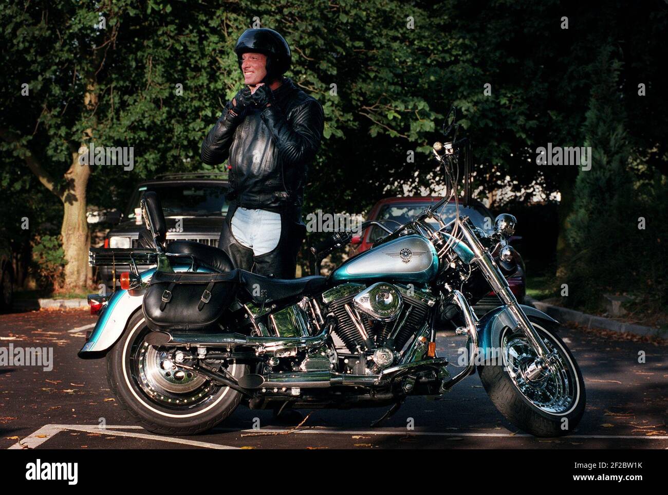 Lord Brockett puts on his crash helmet August 1998 as he prepares to ...
