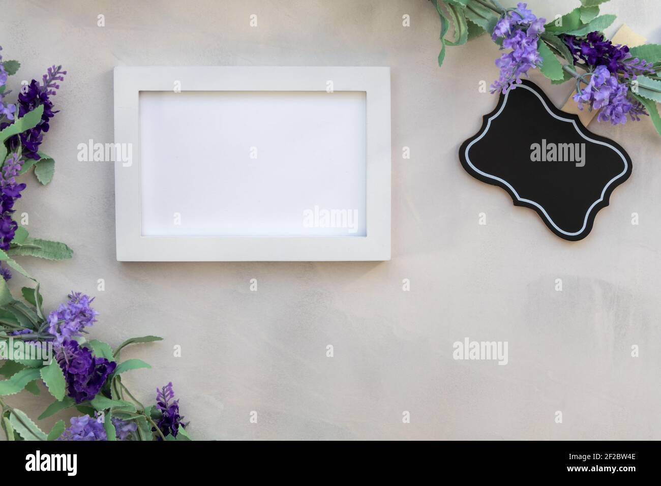 White frame mockup and lilac on gray wash background flat lay copy ...