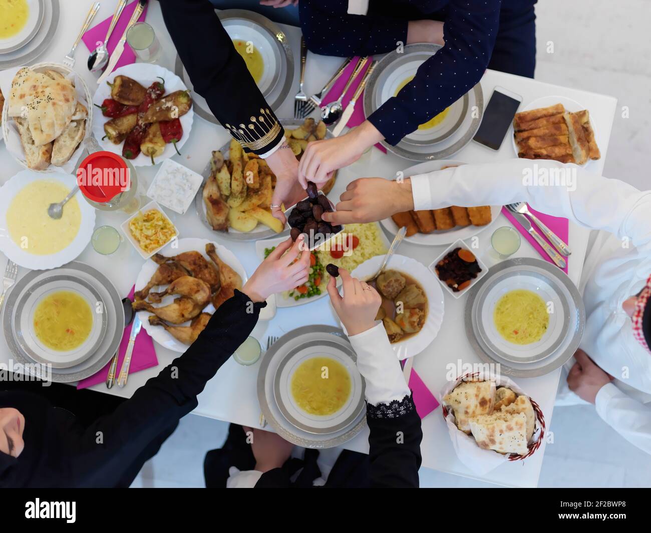 Top view of Muslim family having iftar together during Ramadan. Arabian ...