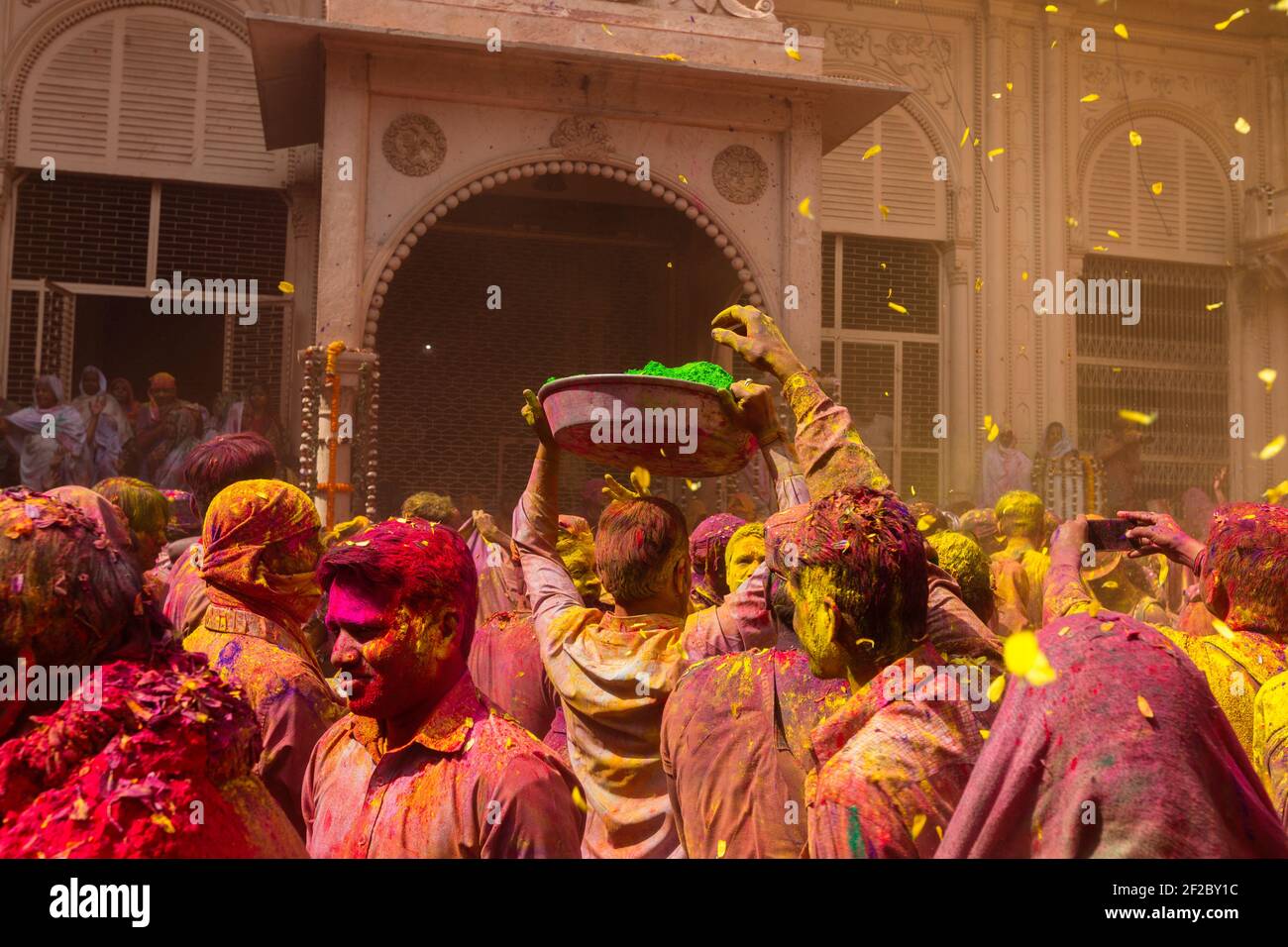 India, Vrindavan - Devotees at the widow's Holi held at Gopinath Temple ...