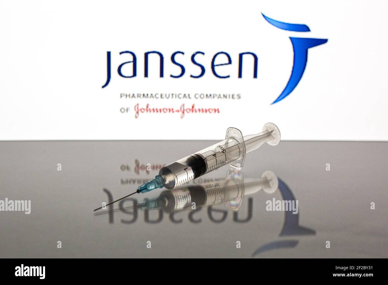 In this photo illustration, a medical syringe seen displayed in front ...