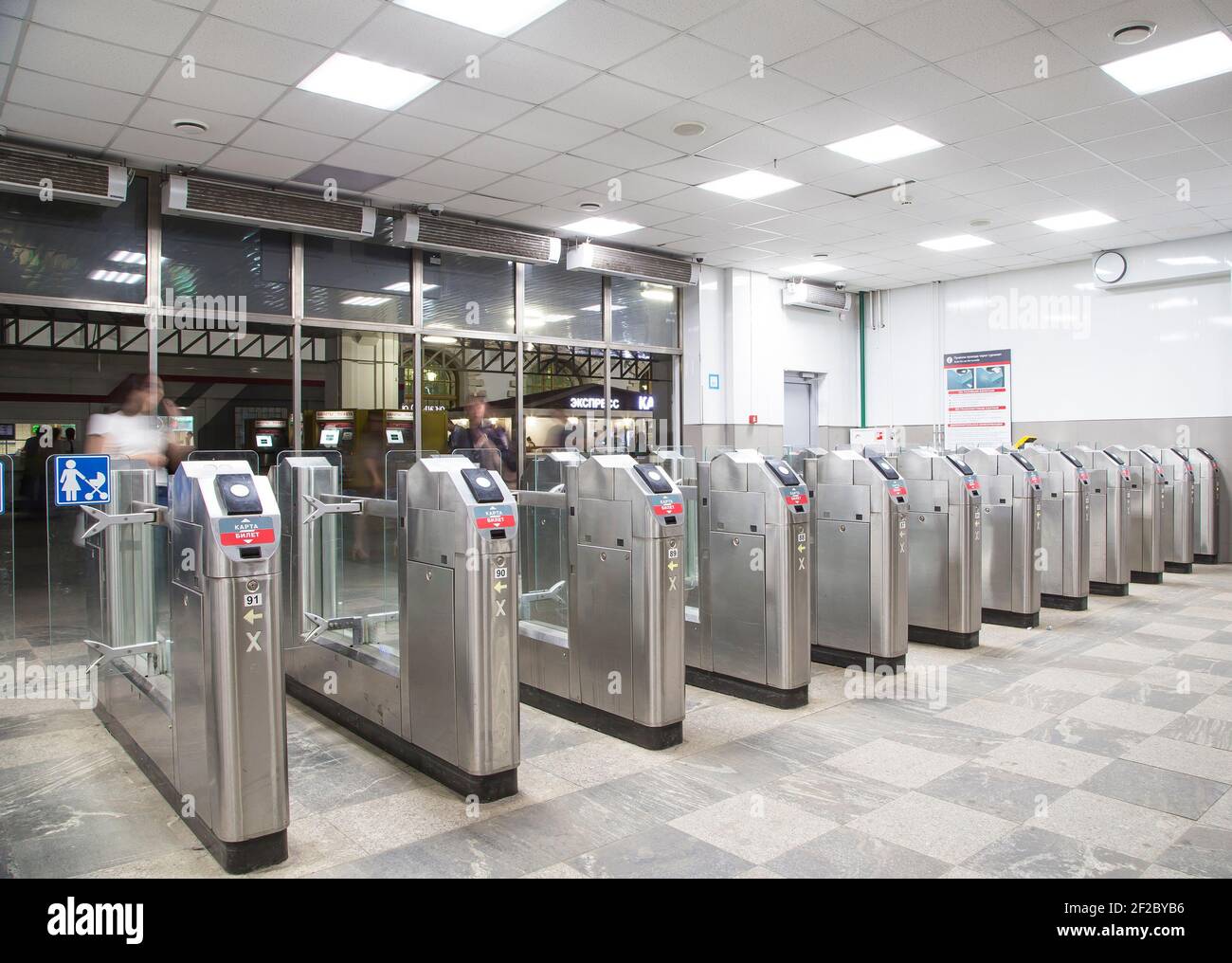 Modern metallic turnstile gate, entrance of railway station. Moscow ...