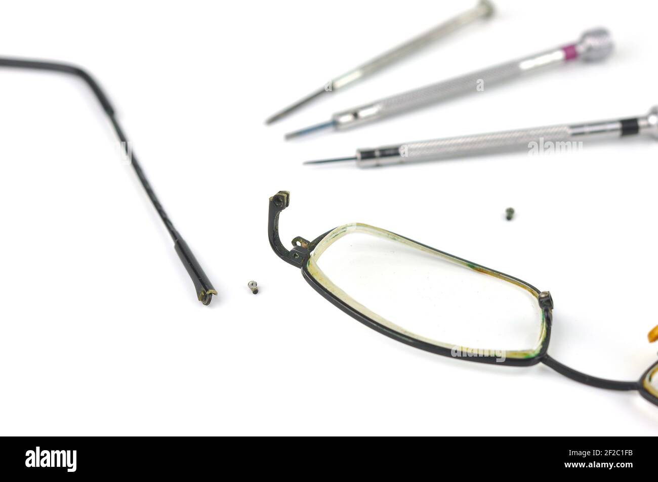 Broken eyeglasses isolated on white background. Eyeglasses repair ...