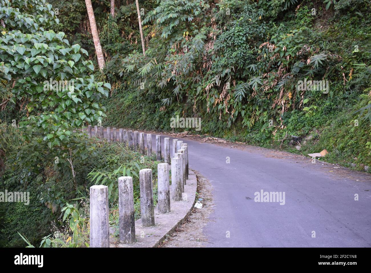 Lonely Pitch Road with Sharp Bend and side protection Stubs Stock Photo ...
