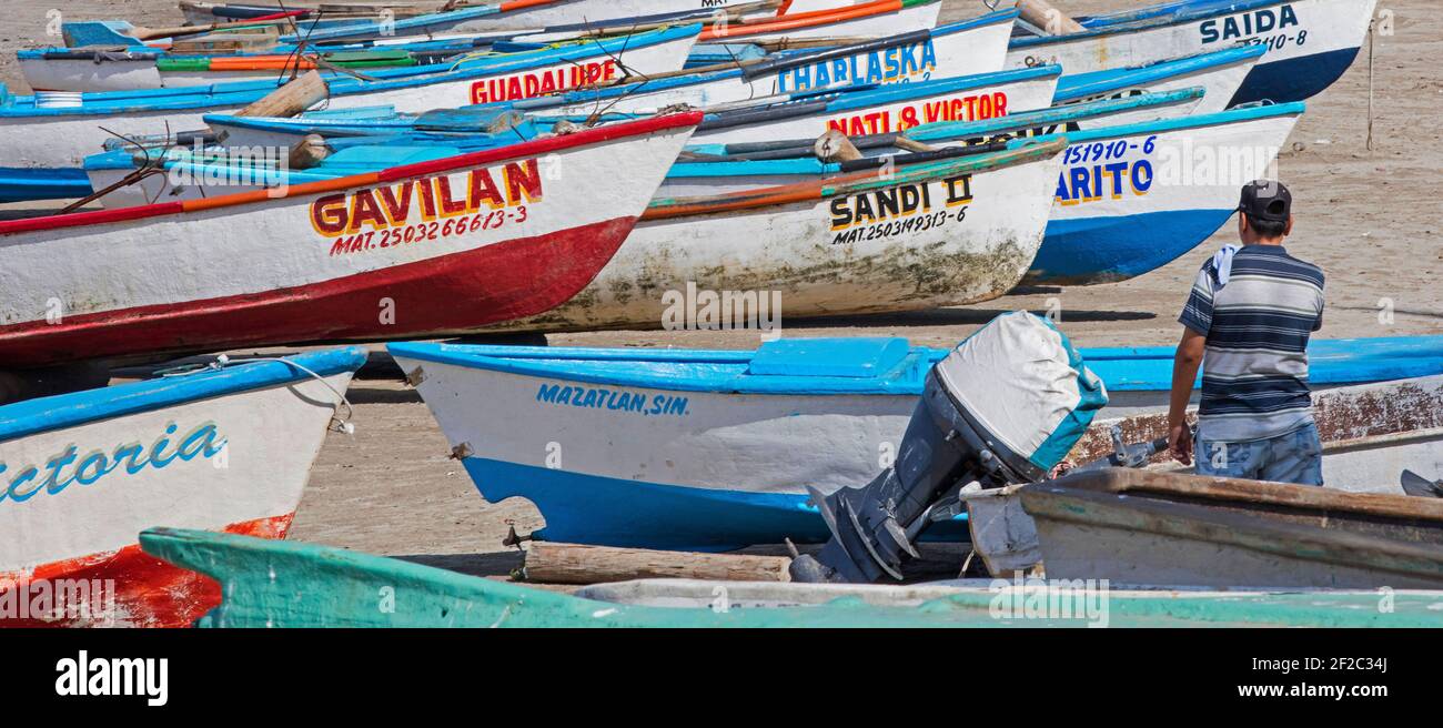 Colourful traditional wooden fishing boats on the beach at Mazatlán ...