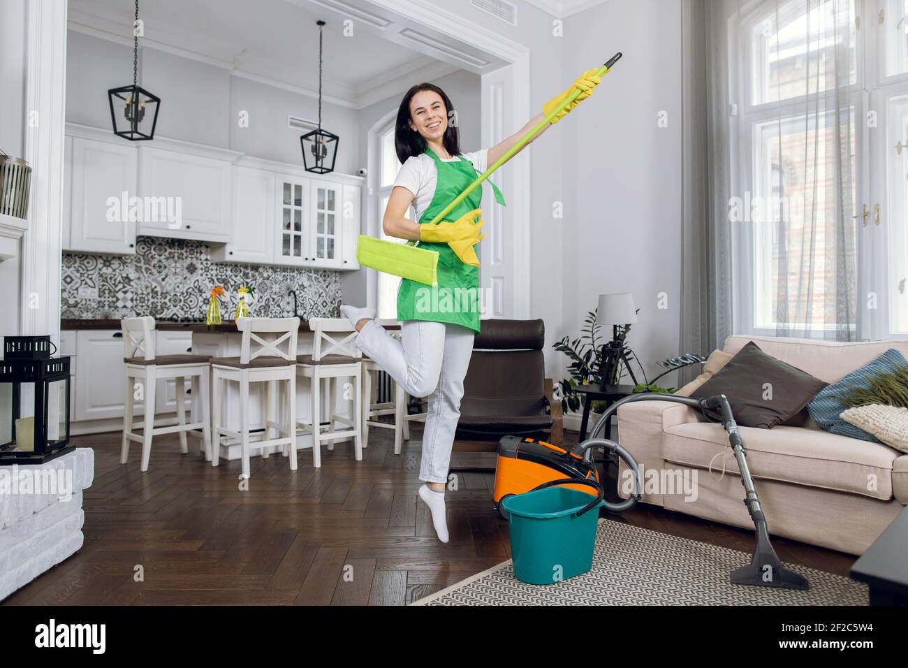 Happy woman dancing mopping hi-res stock photography and images - Alamy