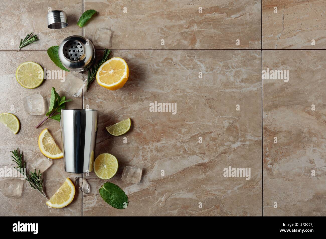 Shaker with ingredients for making cocktails. Brown ceramic background ...