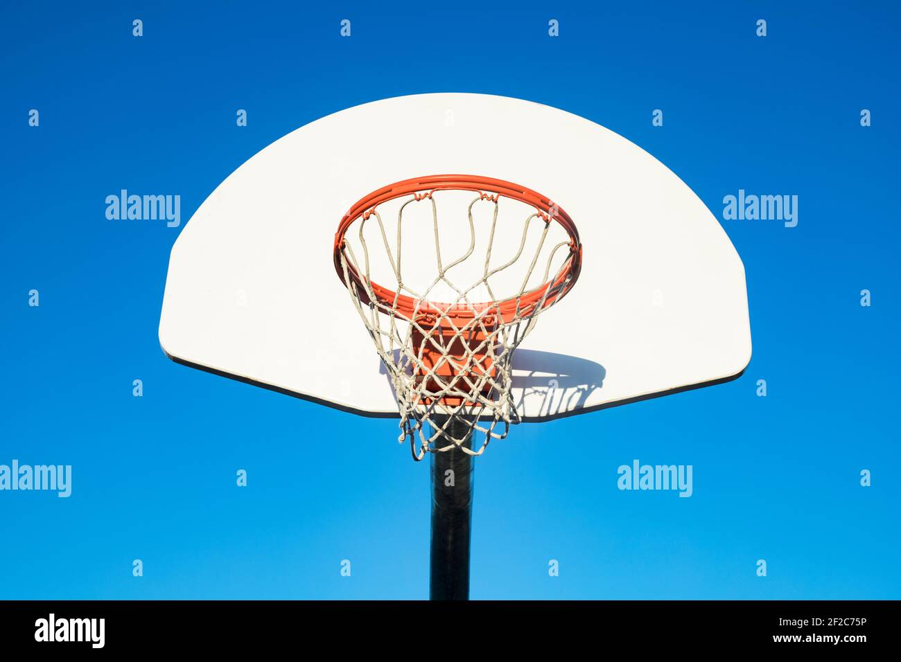 Basketball hoop on blue sky background in th school yard Stock Photo ...