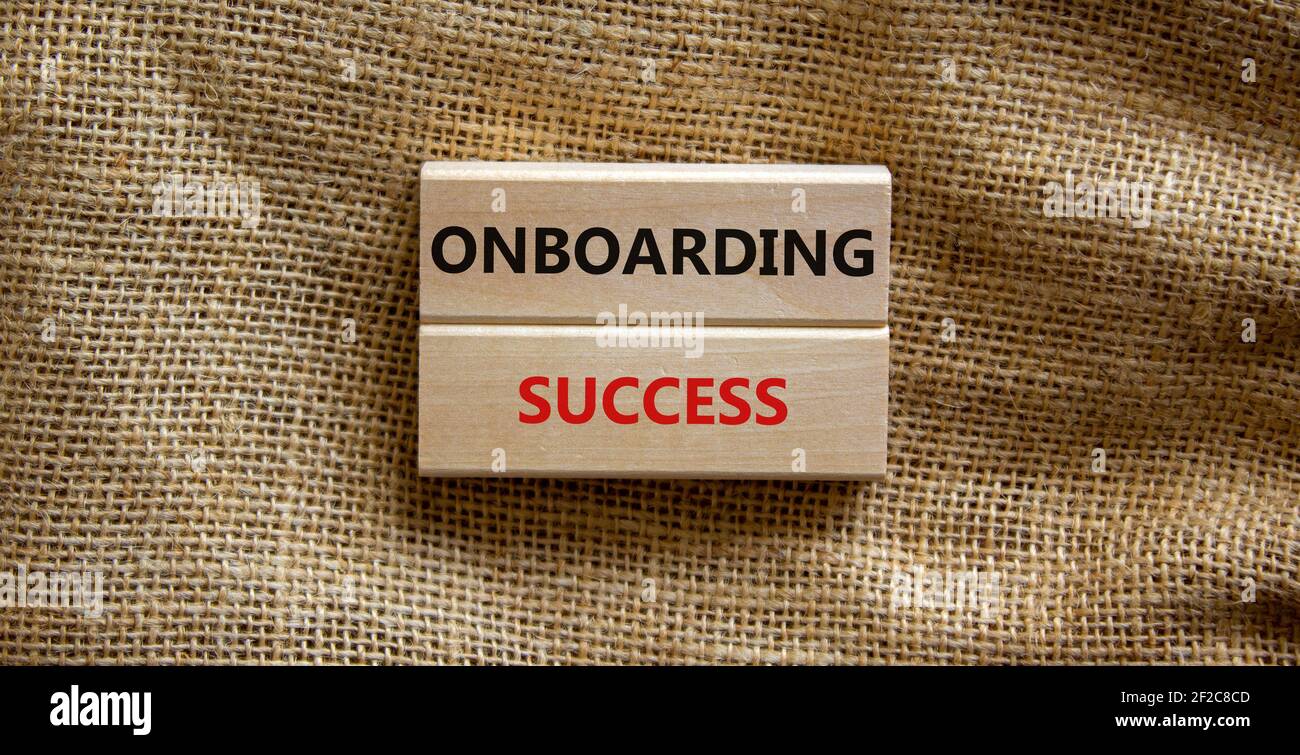 Onboarding success symbol. Wooden blocks with words 'Onboarding success ...