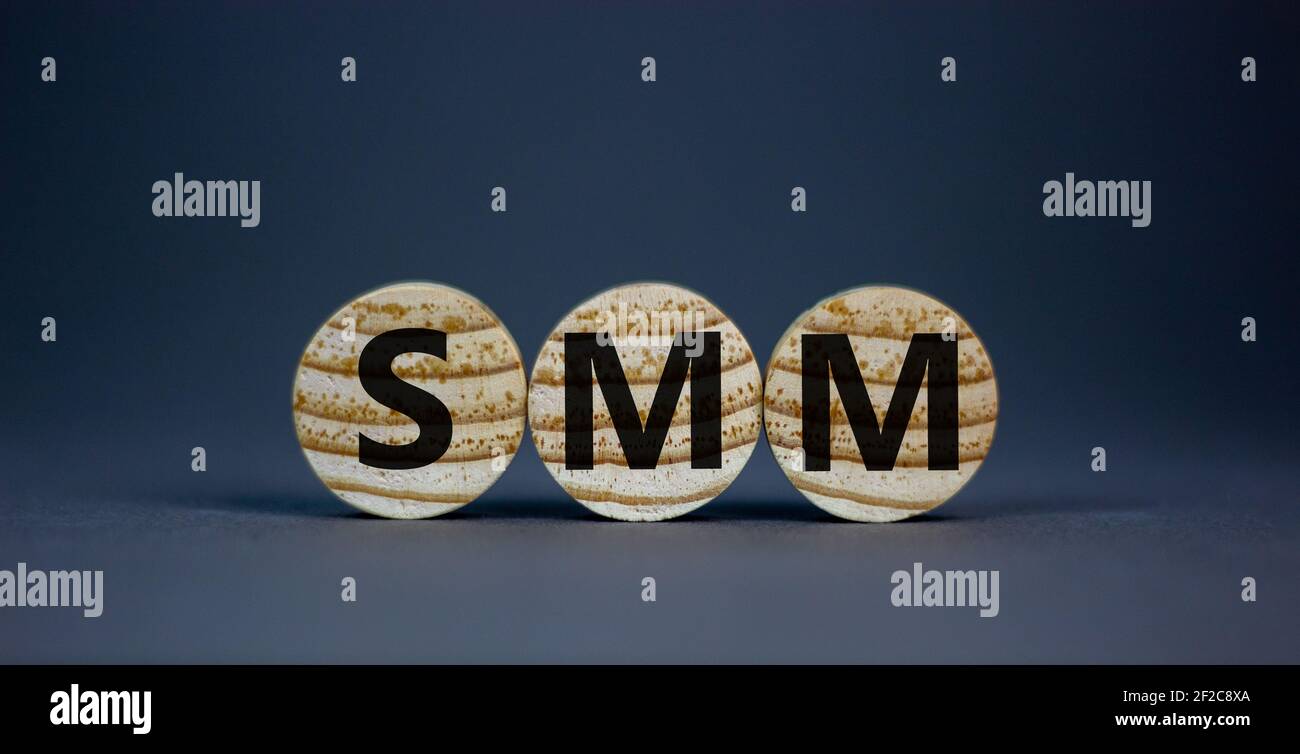 SMM, social media marketing symbol. Wooden circles with word 'SMM ...
