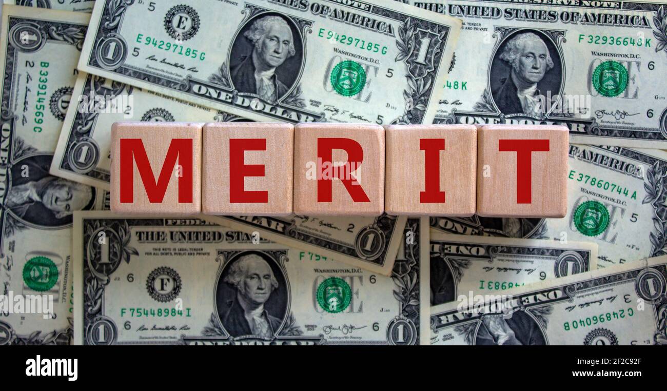 Merit symbol. Wooden cubes with the word 'merit'. Beautiful background ...