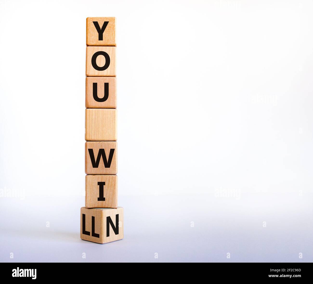 You will win symbol. Turned a wooden cube and changed words you will to ...