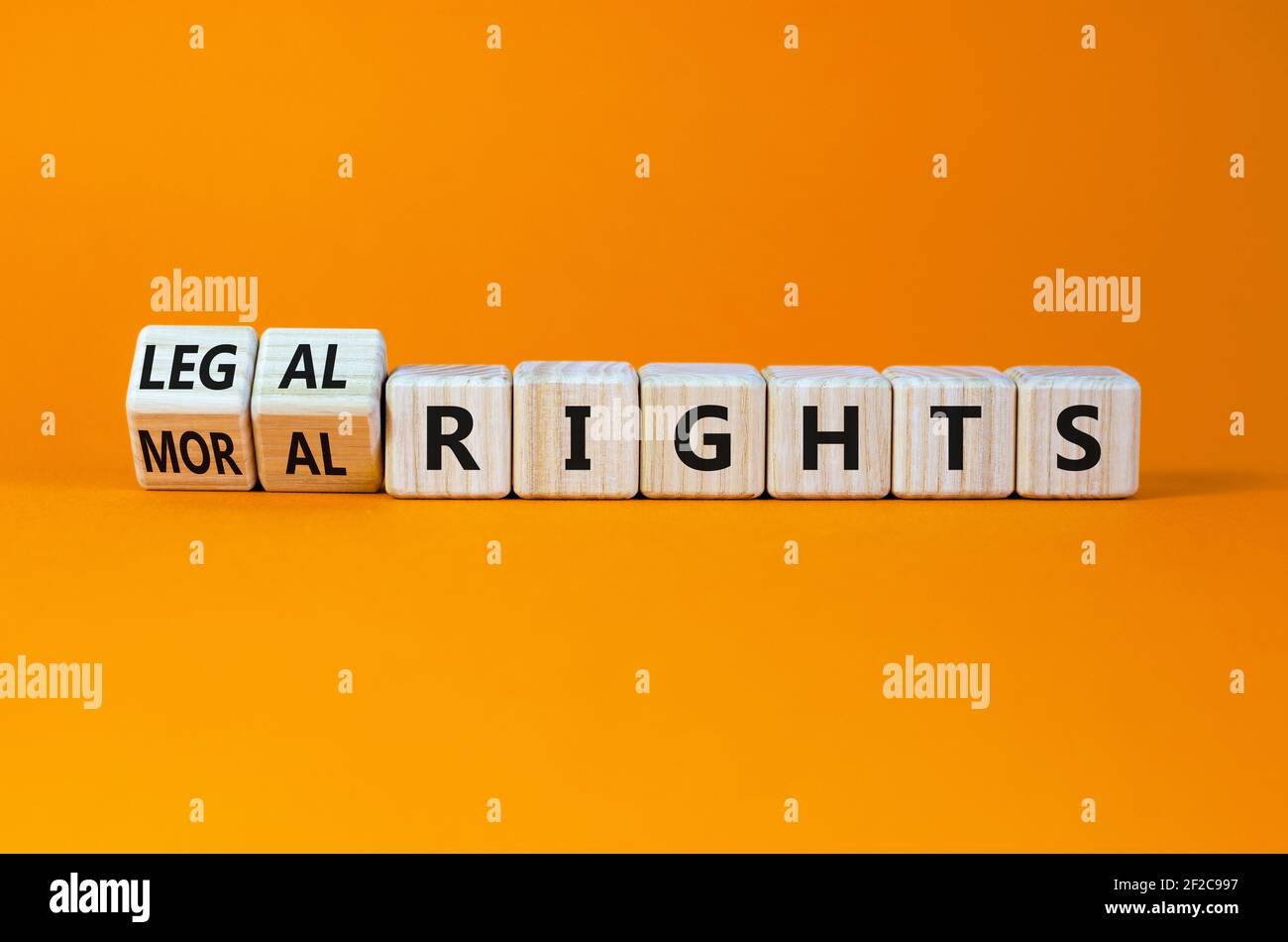 Moral or legal rights symbol. Turned wooden cubes and changed words ...