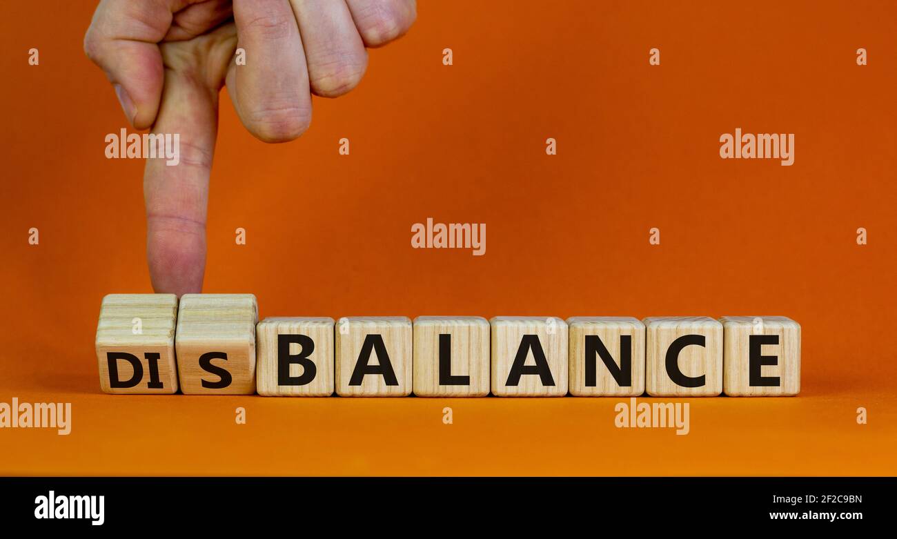 Balance or disbalance symbol. Businessman turns cubes and changes the ...