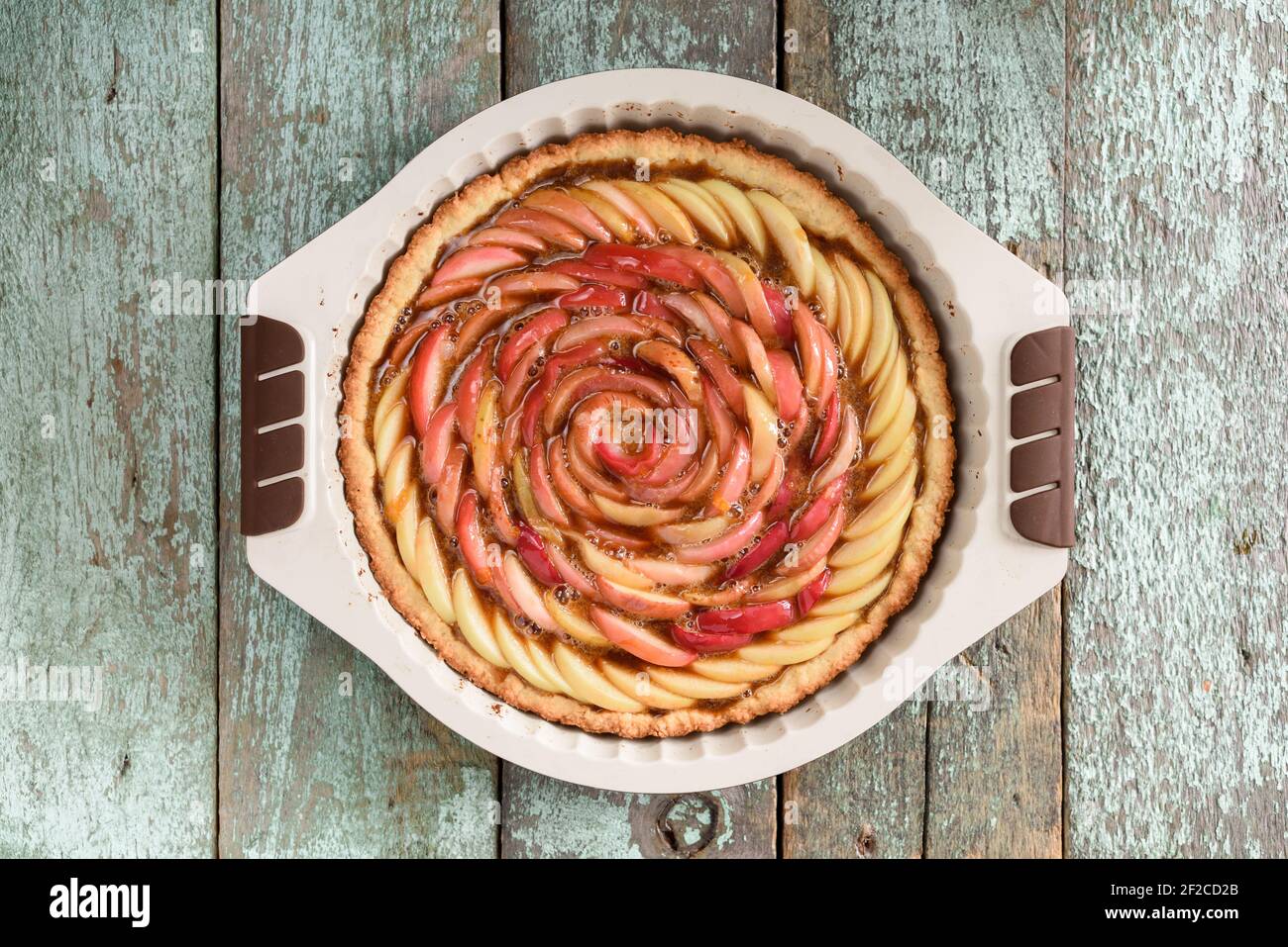 Homemade delicious rose shaped apple pie with frangipane filling in ...