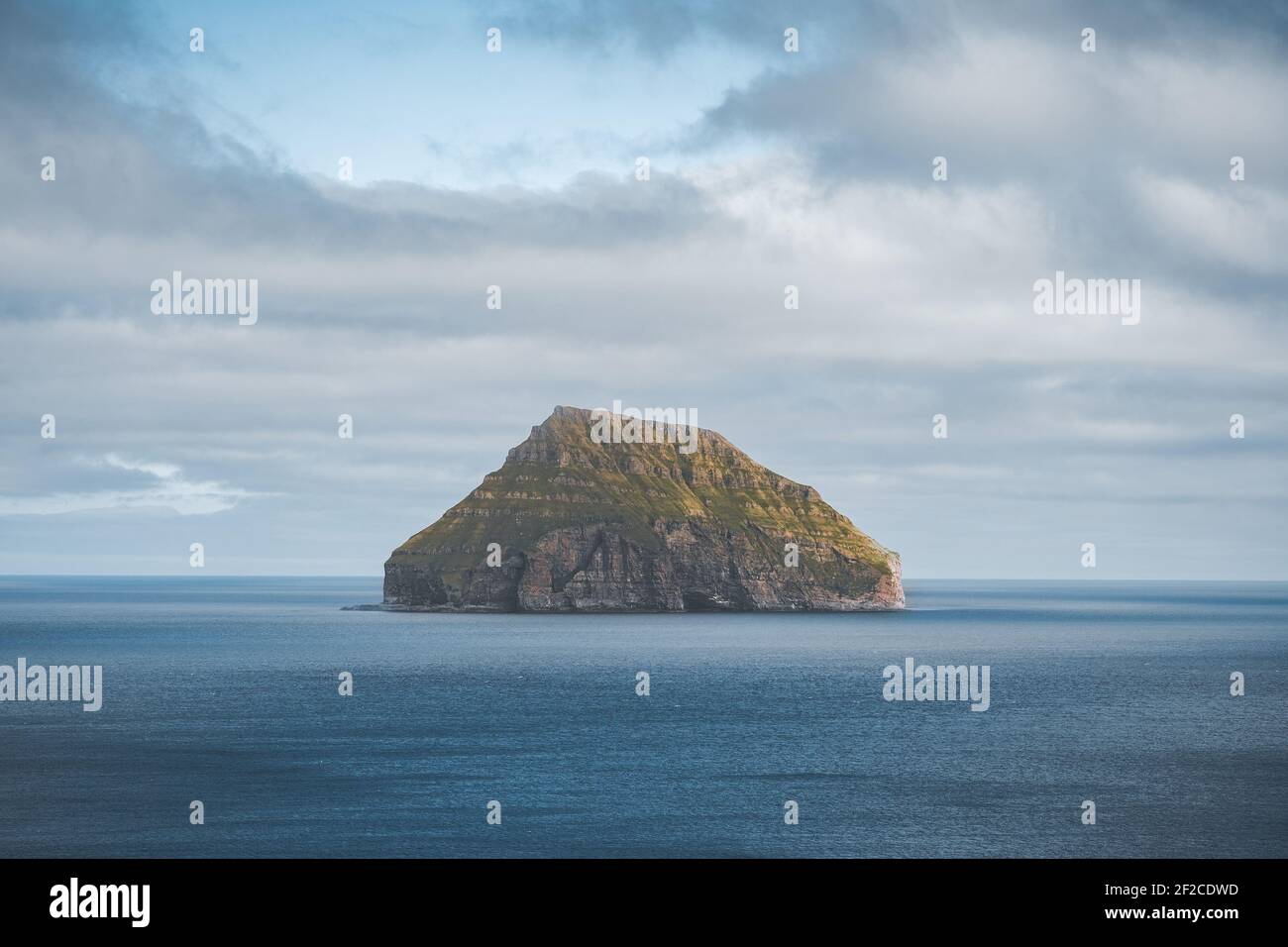 Picturesque green cliffs on Litla Dimun island and atlantic ocean in ...