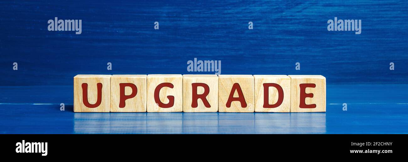 Wooden blocks with the word Upgrade. Improvement, modernization and ...
