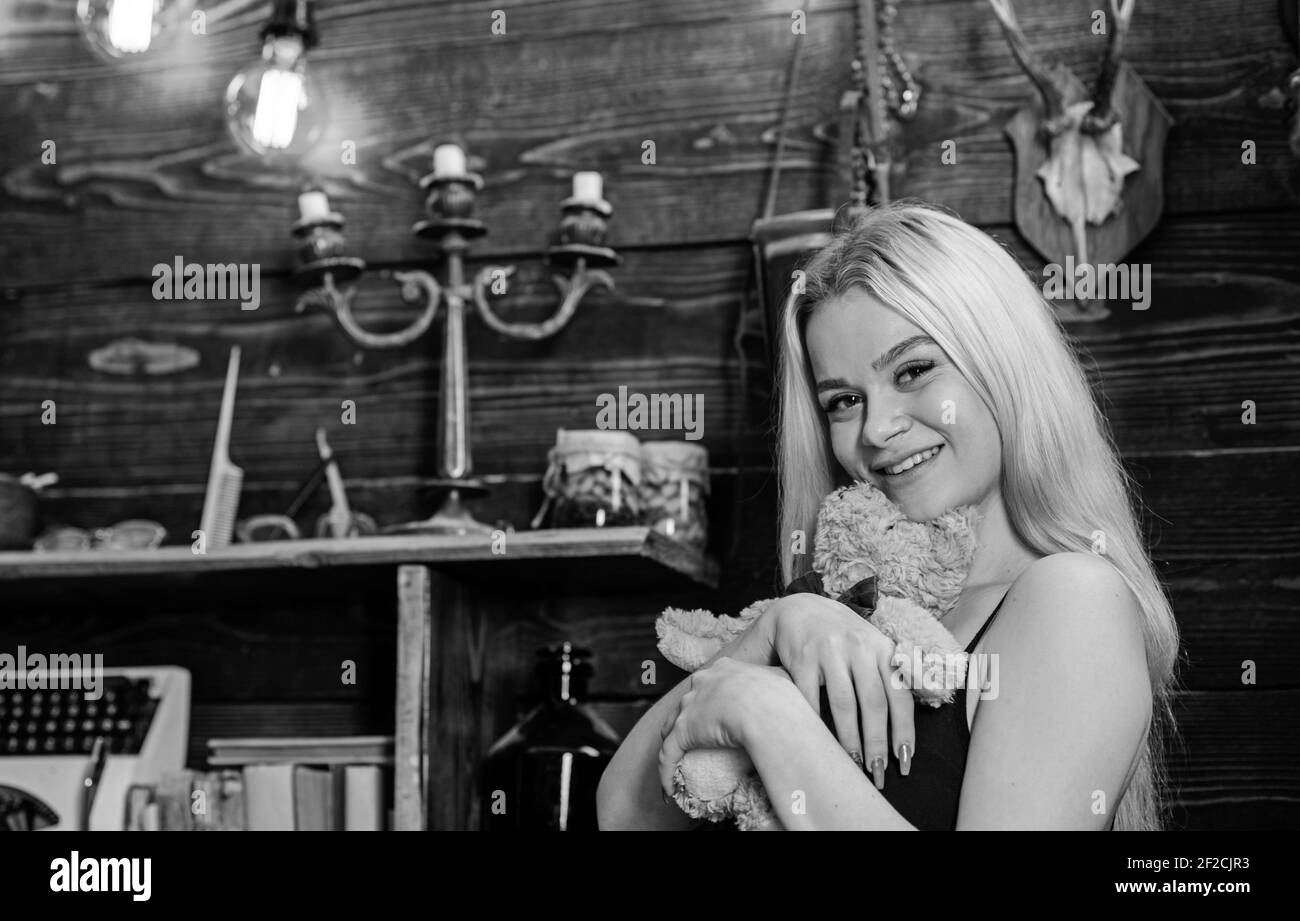 Lady blonde enjoy leisure with teddy bear. Woman on smiling face ...