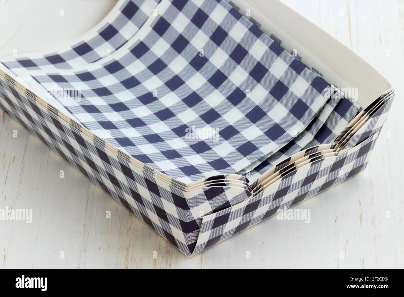 Blue gingham party supplies tableware set Stock Photo - Alamy