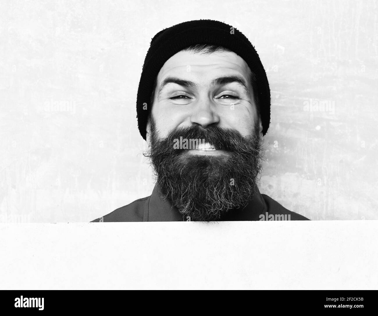 bearded man posing on studio wall background Stock Photo - Alamy
