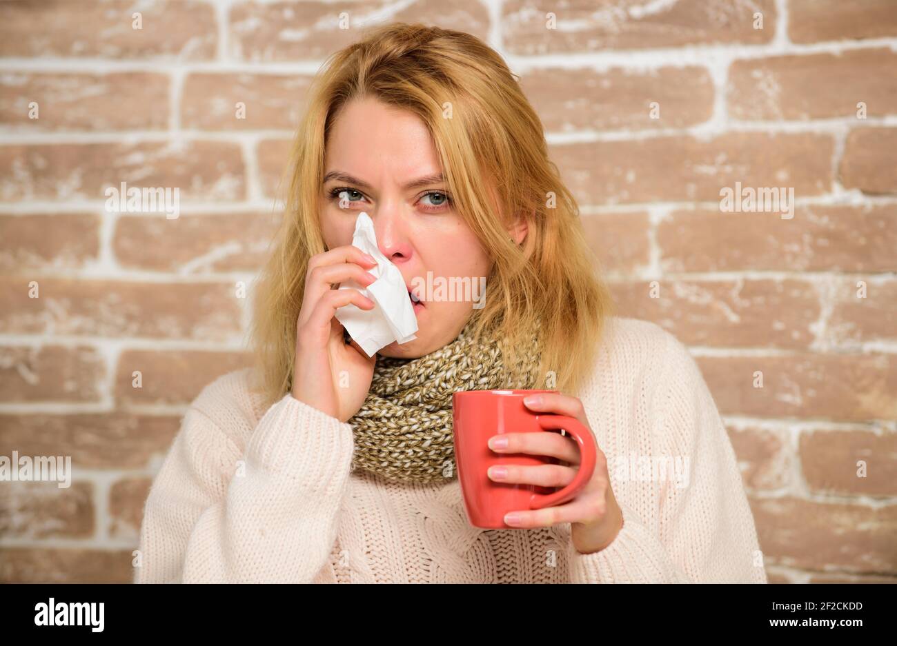 Tips how to get rid of cold. Woman feels badly ill sneezing. Girl in ...