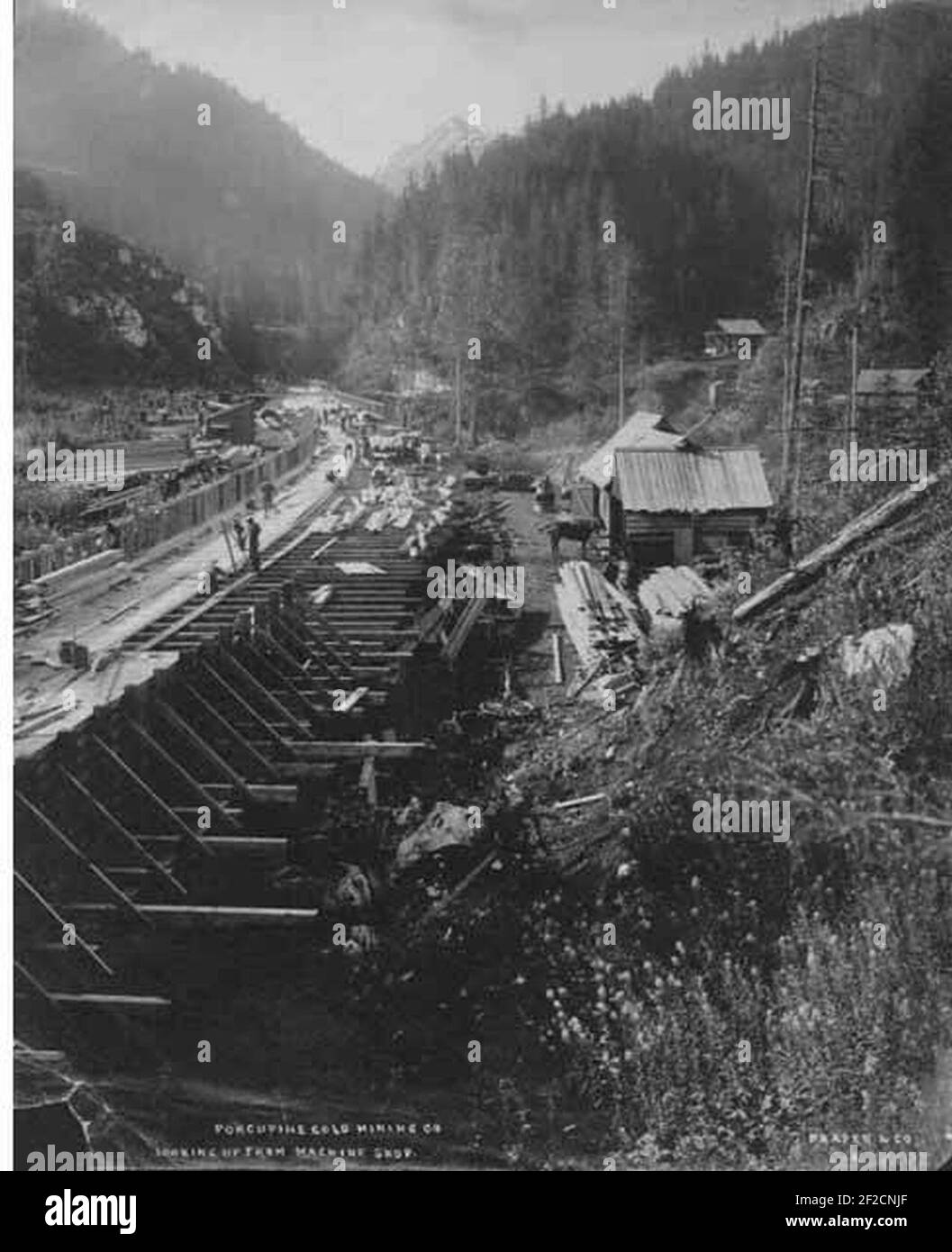 Porcupine Gold Mining Company flume under construction with workmen ...