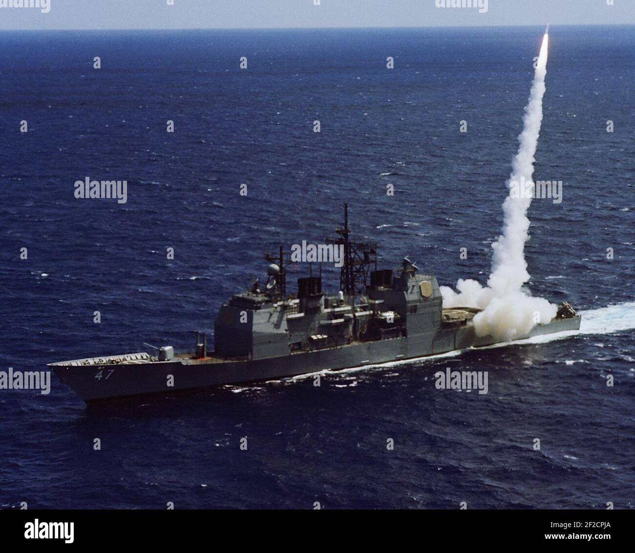 Port bow view of USS Ticonderoga (CG-47) firing Standard II missile in ...