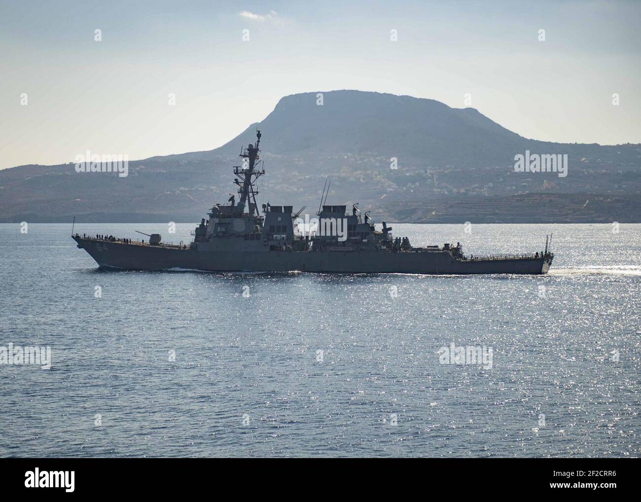 Port side view of USS Carney (DDG-64) departing Souda Bay 161021 Stock ...