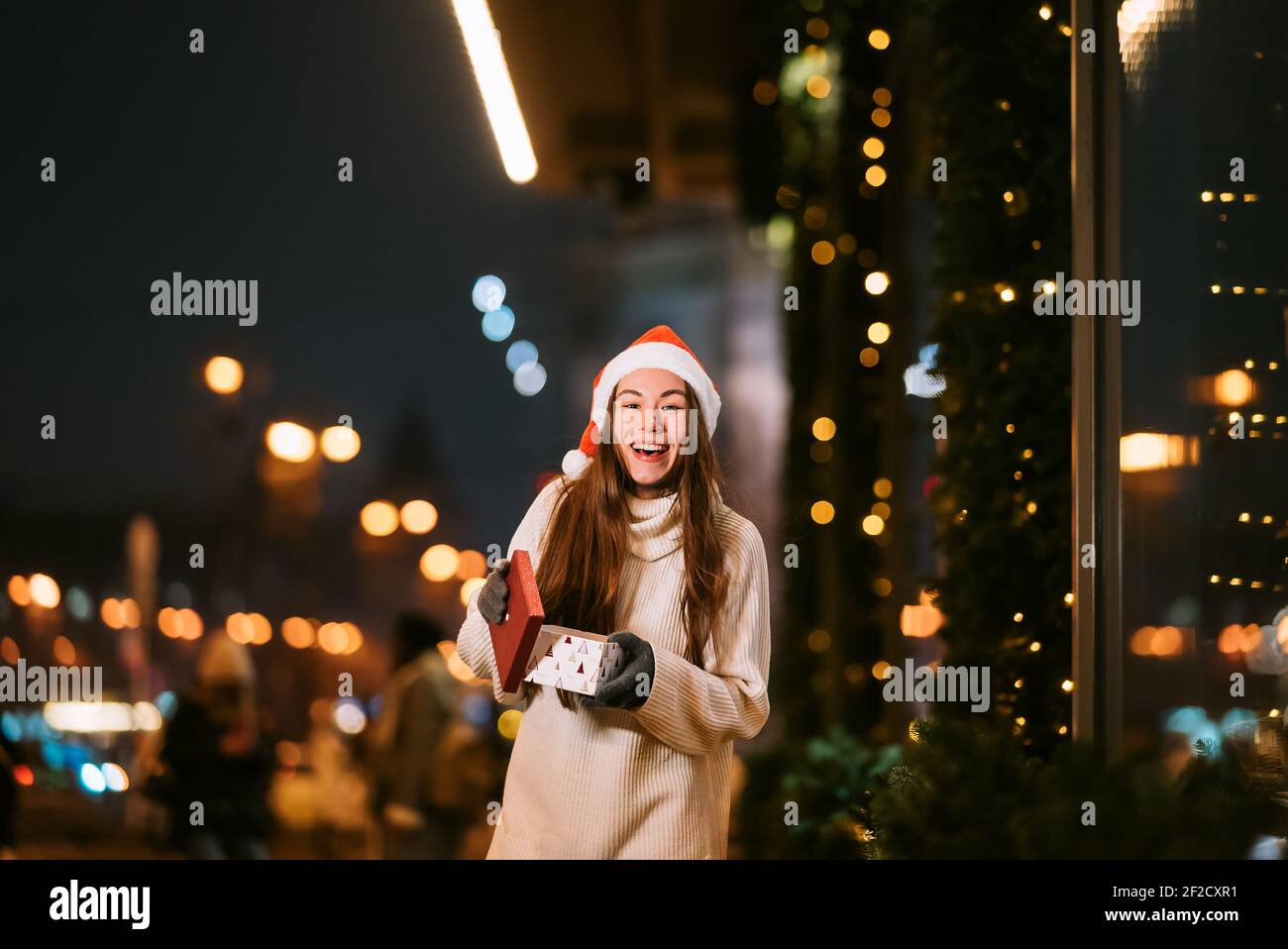 Night street portrait of young beautiful woman acting thrilled Stock ...