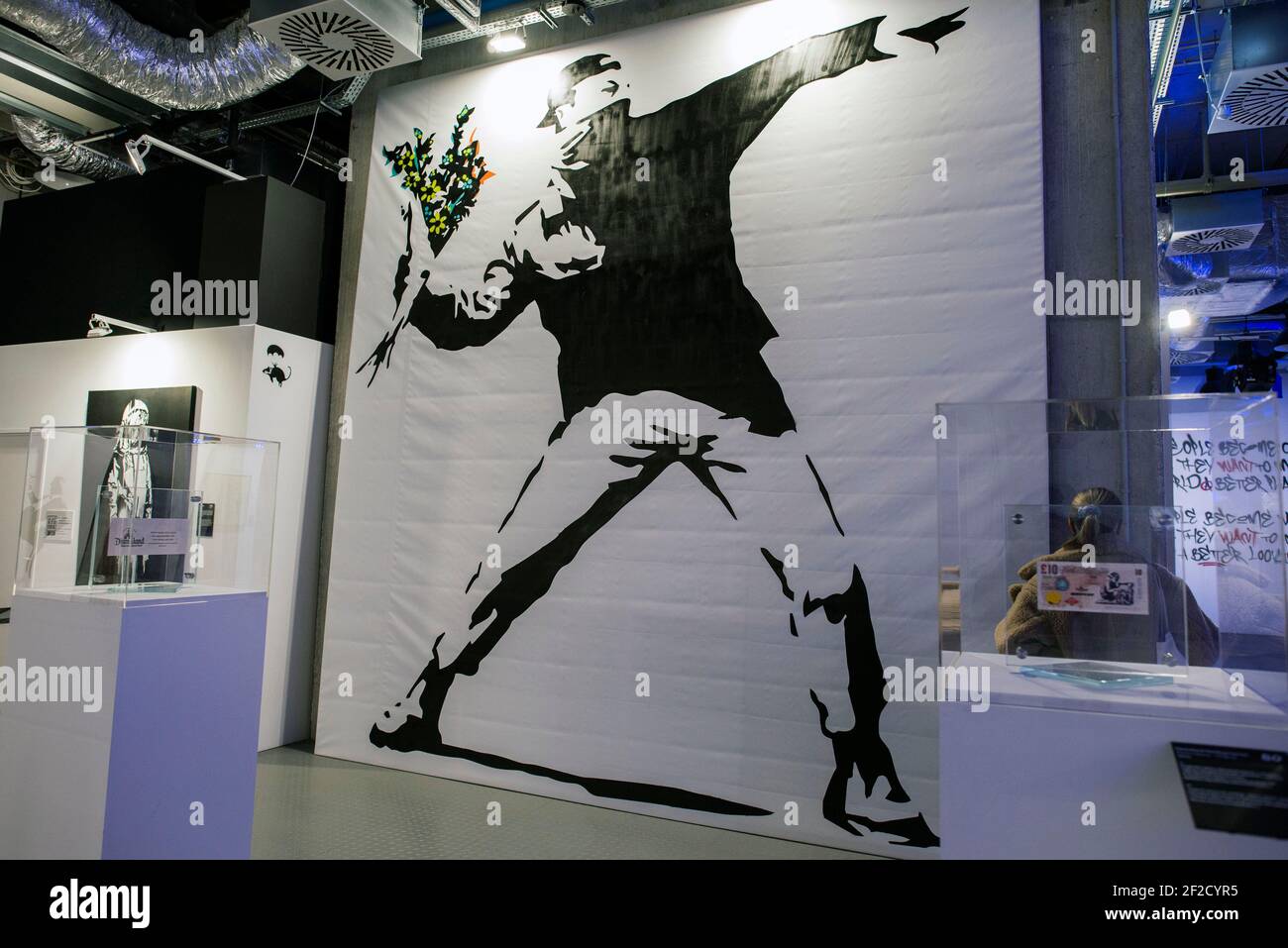 The replica of the iconic "Flower Thrower" graffiti by Banksy seen on a ...