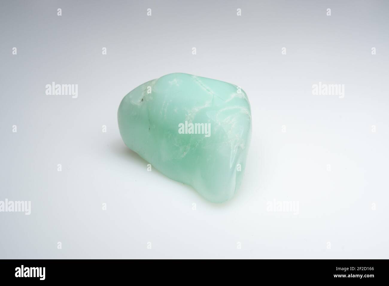 Natural chrysoprase stone on a white background Stock Photo - Alamy