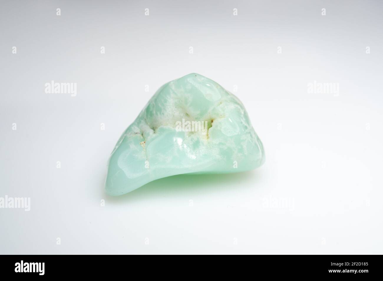 Natural chrysoprase stone on a white background Stock Photo - Alamy
