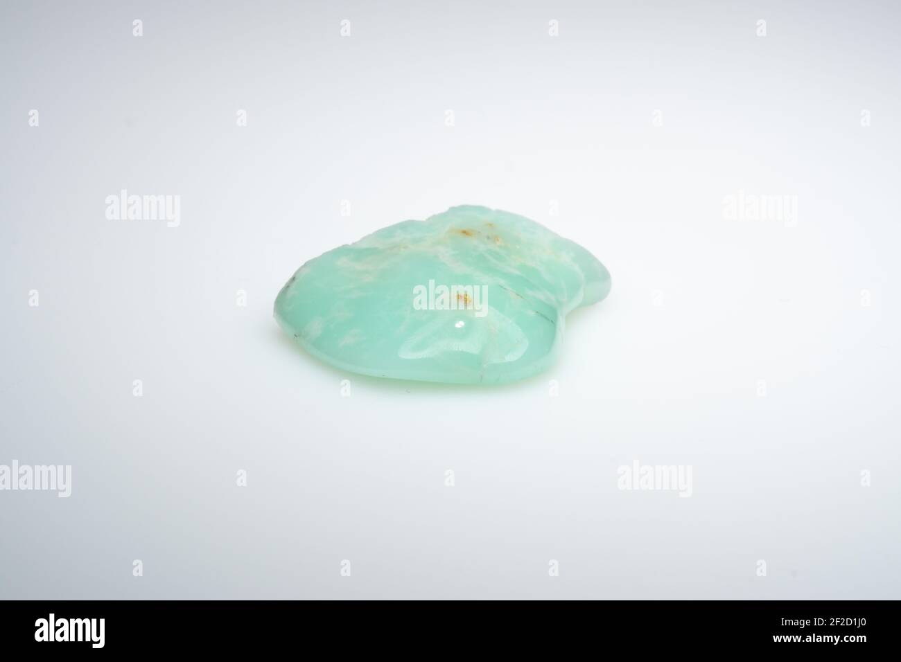 Natural chrysoprase stone on a white background Stock Photo - Alamy