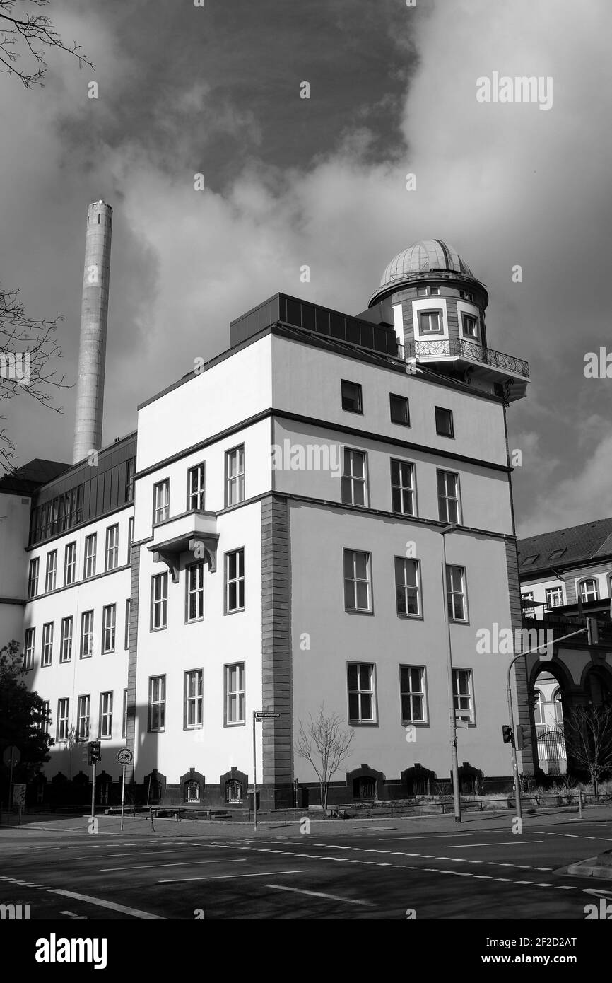 A grayscale shot of a residential building against the cloudy sky Stock ...