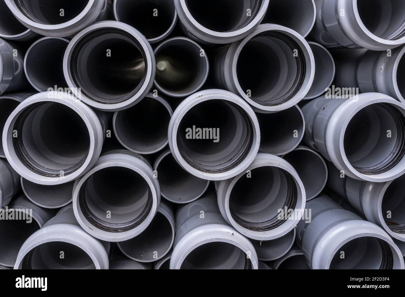 Stack of plastic pipes on a construction site Stock Photo - Alamy